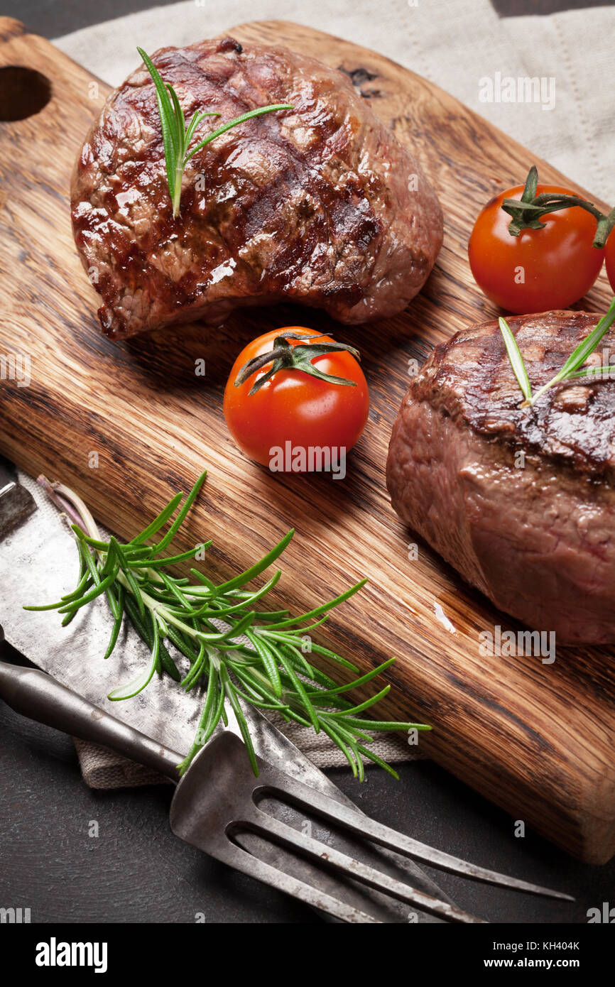 Grilled fillet steak on cutting board Stock Photo - Alamy