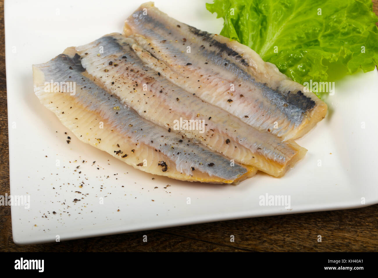 Herring fillet with pepper Stock Photo - Alamy