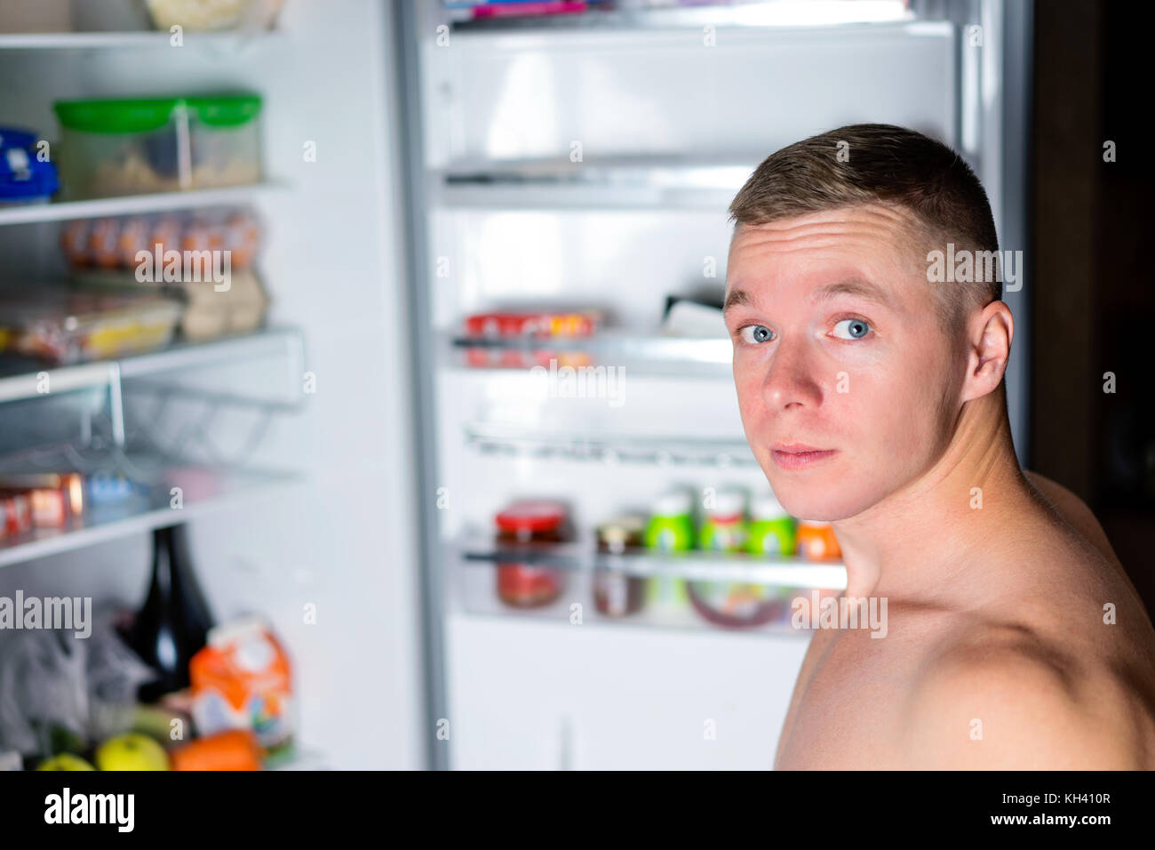man looking for food in the fridge Stock Photo - Alamy