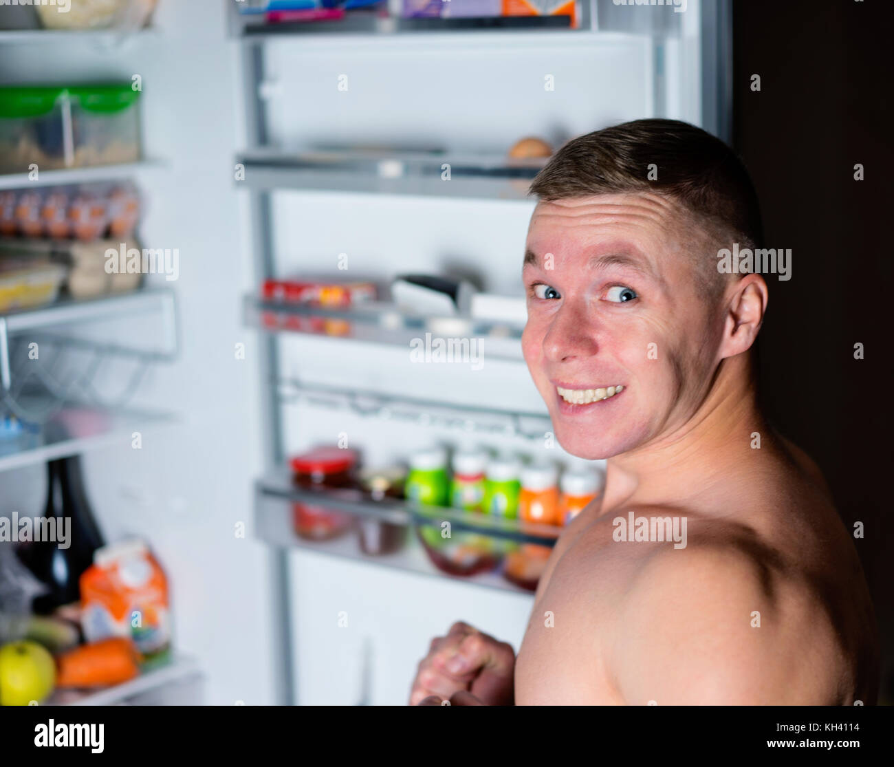 man looking for food in the fridge Stock Photo - Alamy
