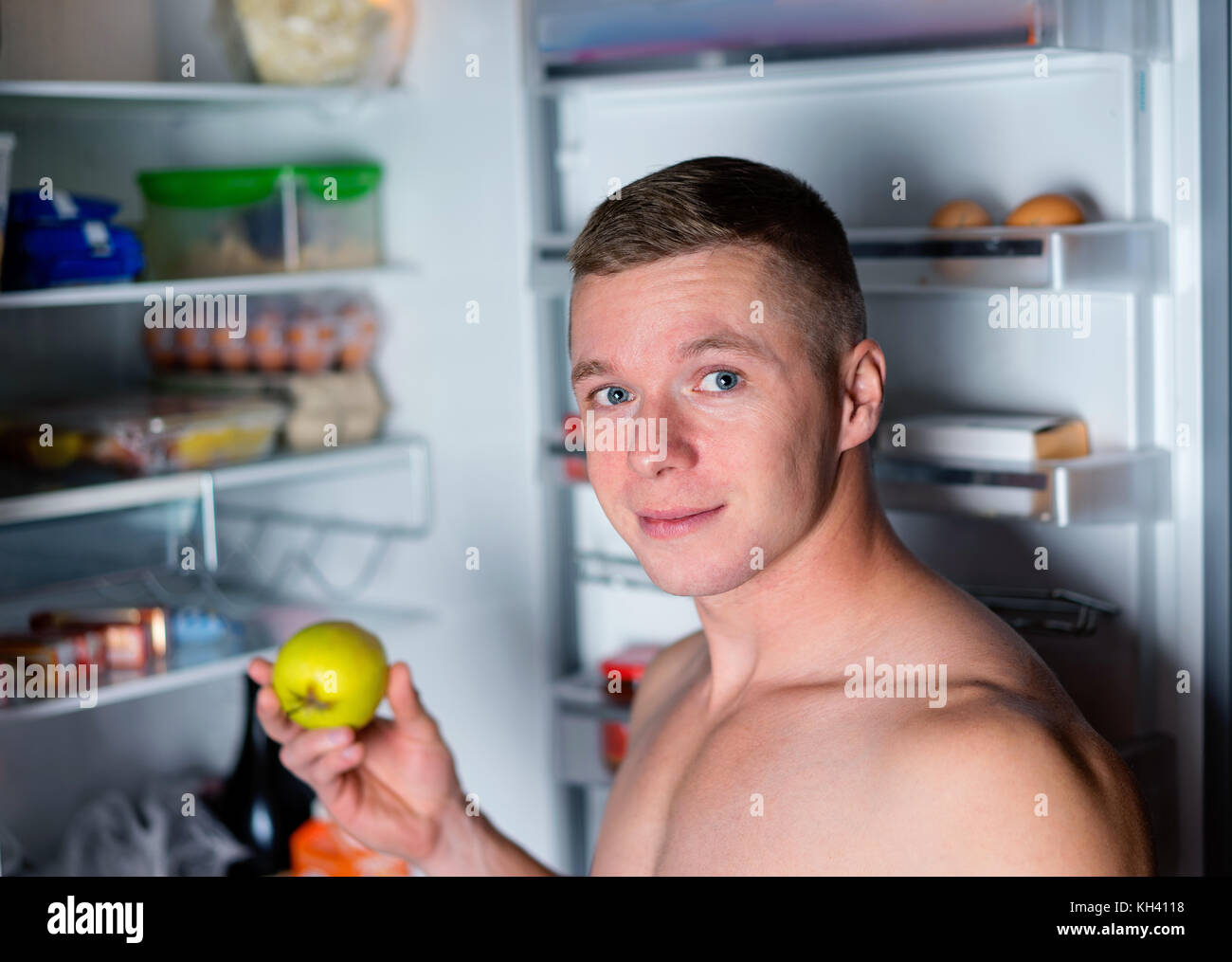 man looking for food in the fridge Stock Photo - Alamy