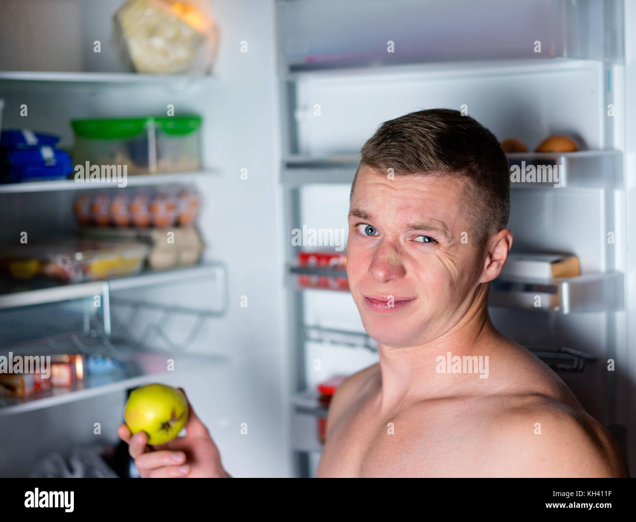 man looking for food in the fridge Stock Photo - Alamy