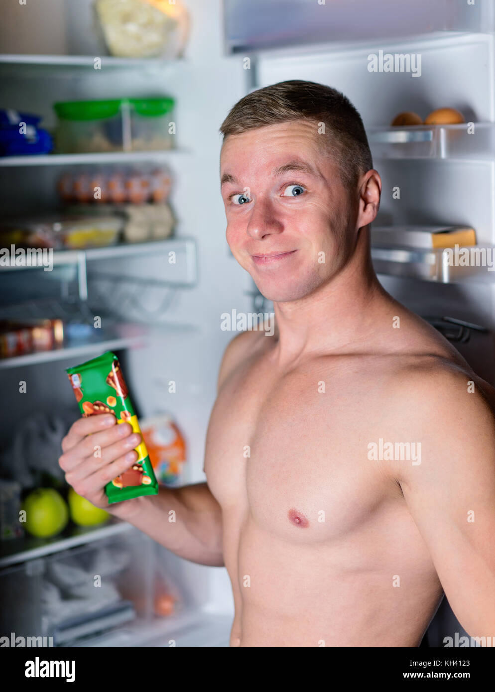 Man looking in fridge hi-res stock photography and images - Alamy