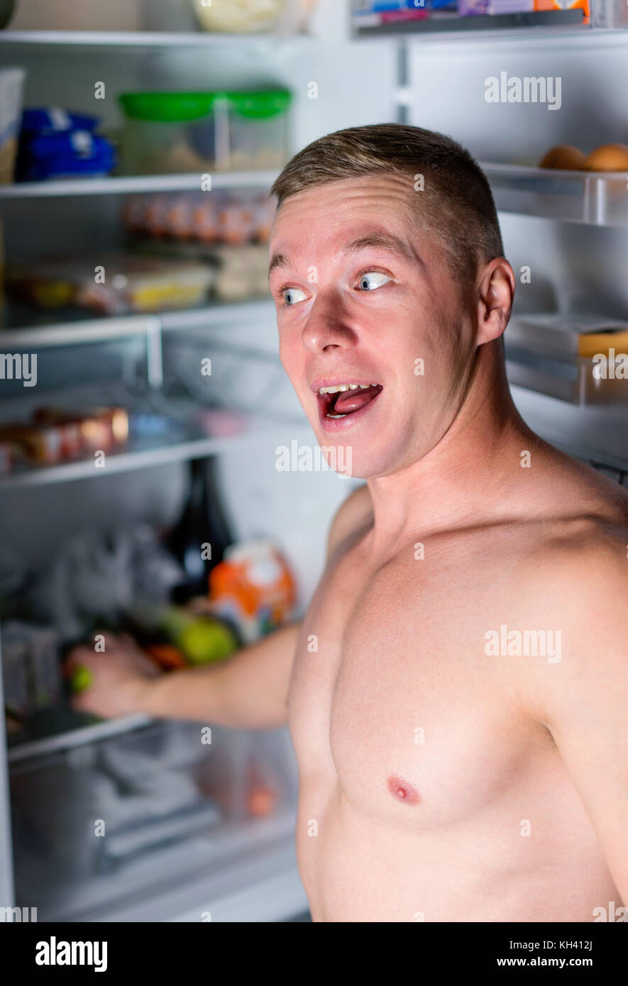 man looking for food in the fridge Stock Photo - Alamy
