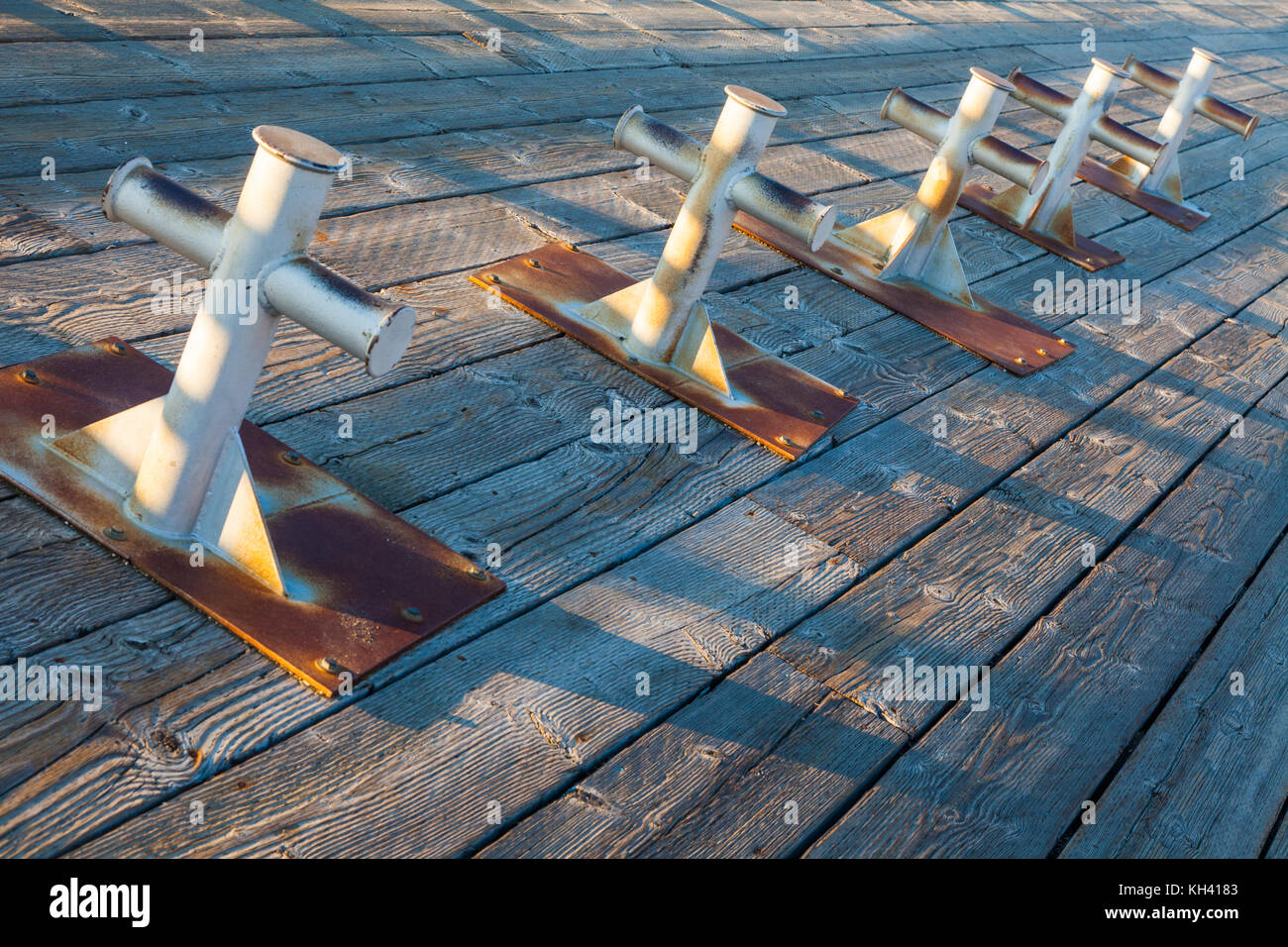 Abstract image of steel structures bolted to a wooden jetty for ...