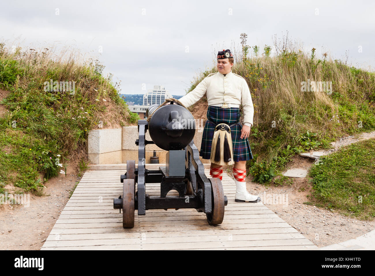 A Canadian soldier stands alongside a canon in Fort George on Citadel ...