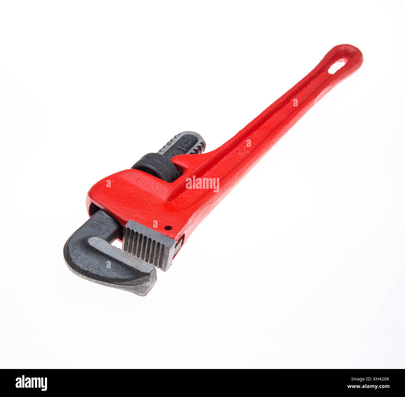 Large red pipe wrench isolated on white Stock Photo - Alamy