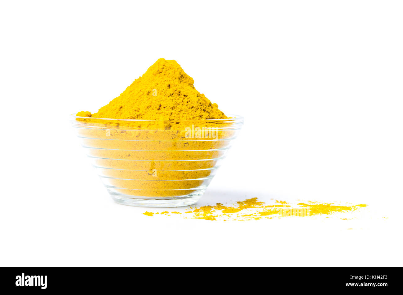 Curry powder in a bowl isolated on white Stock Photo - Alamy