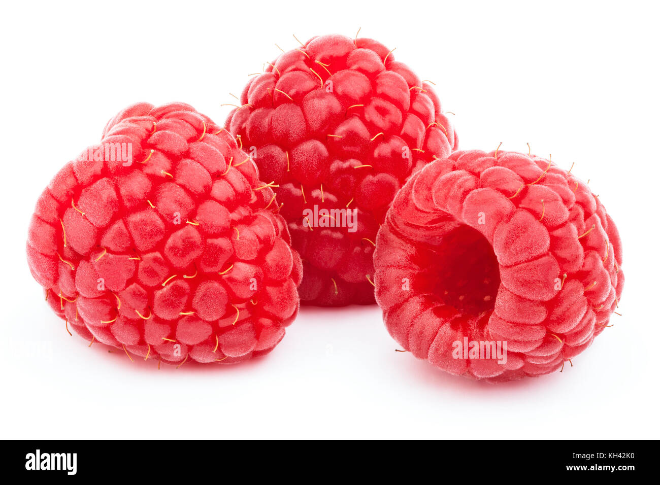 Three ripe raspberries isolated Stock Photo - Alamy
