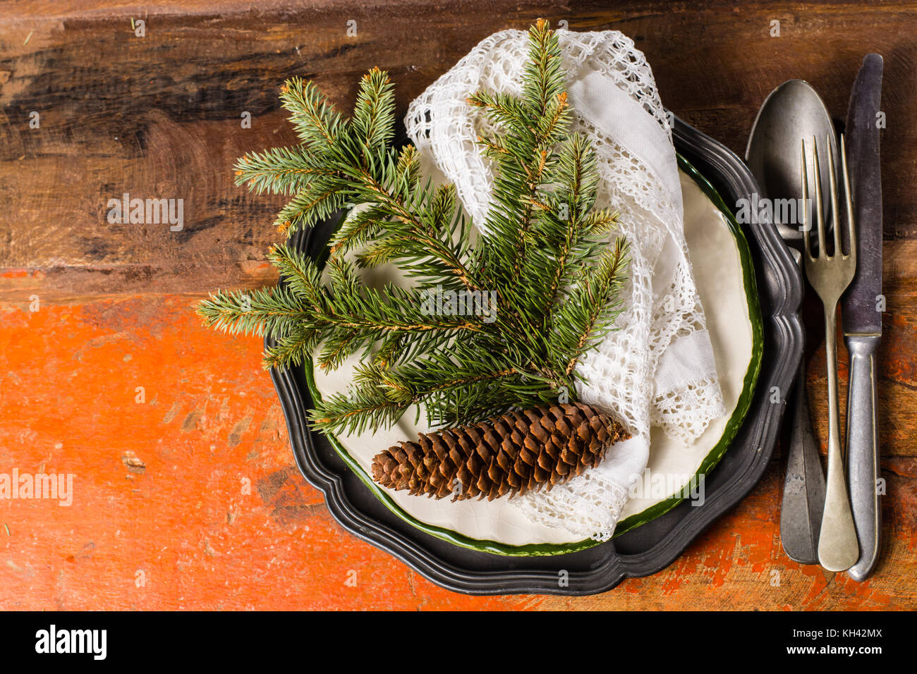 Vintage Christmas dinner table serving with old tin plate, copy space ...