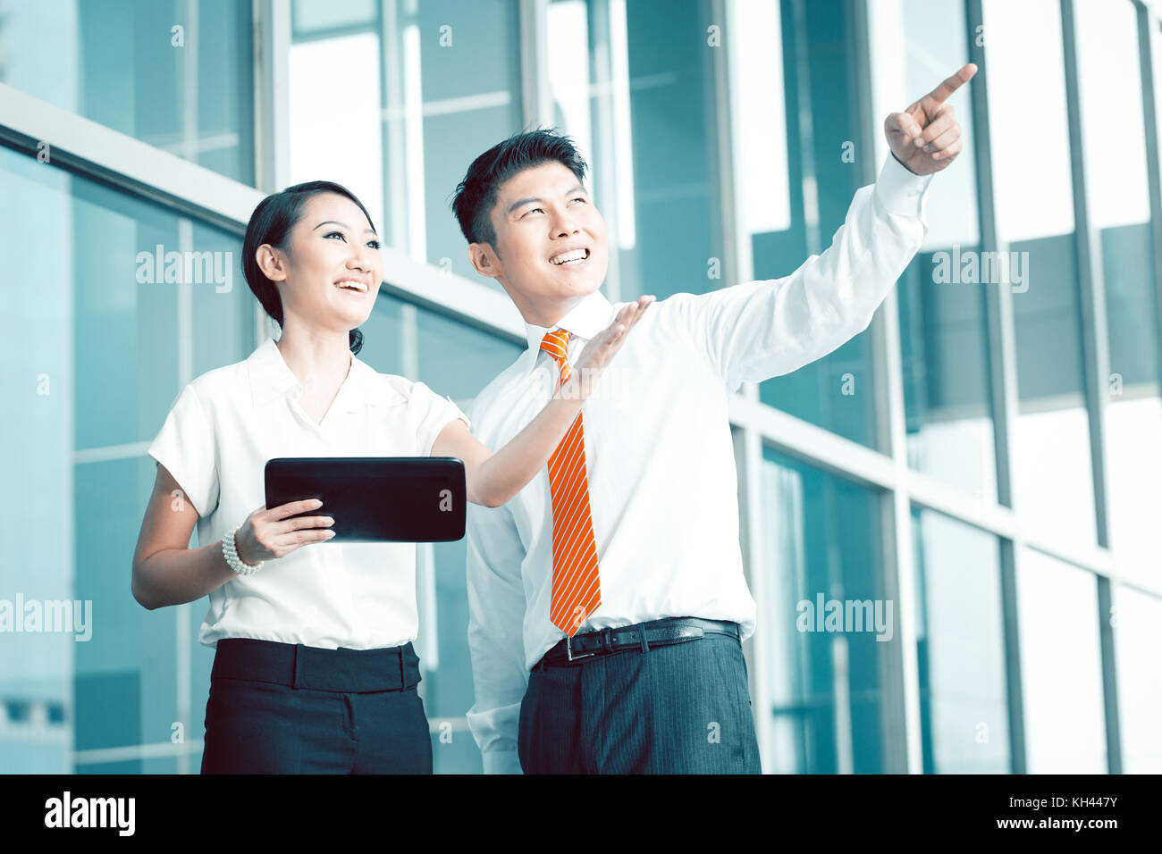 Chinese business man explaining his vision or idea to colleague Stock ...