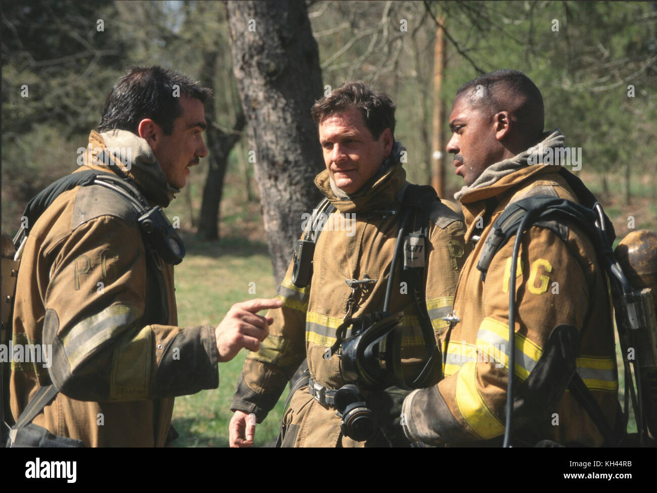 Three firefighters talking after fighting a fire Stock Photo - Alamy