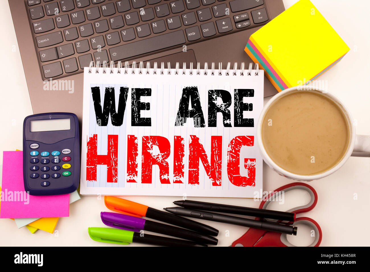 We Are Hiring Writing text in the office with surroundings such as ...