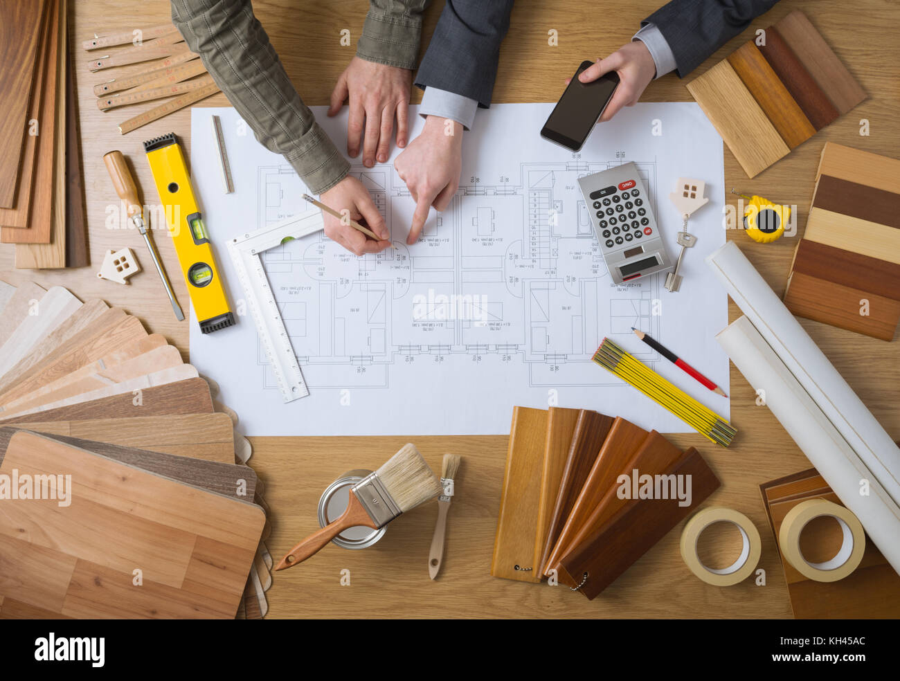 Business people working together on a building project, desktop top ...