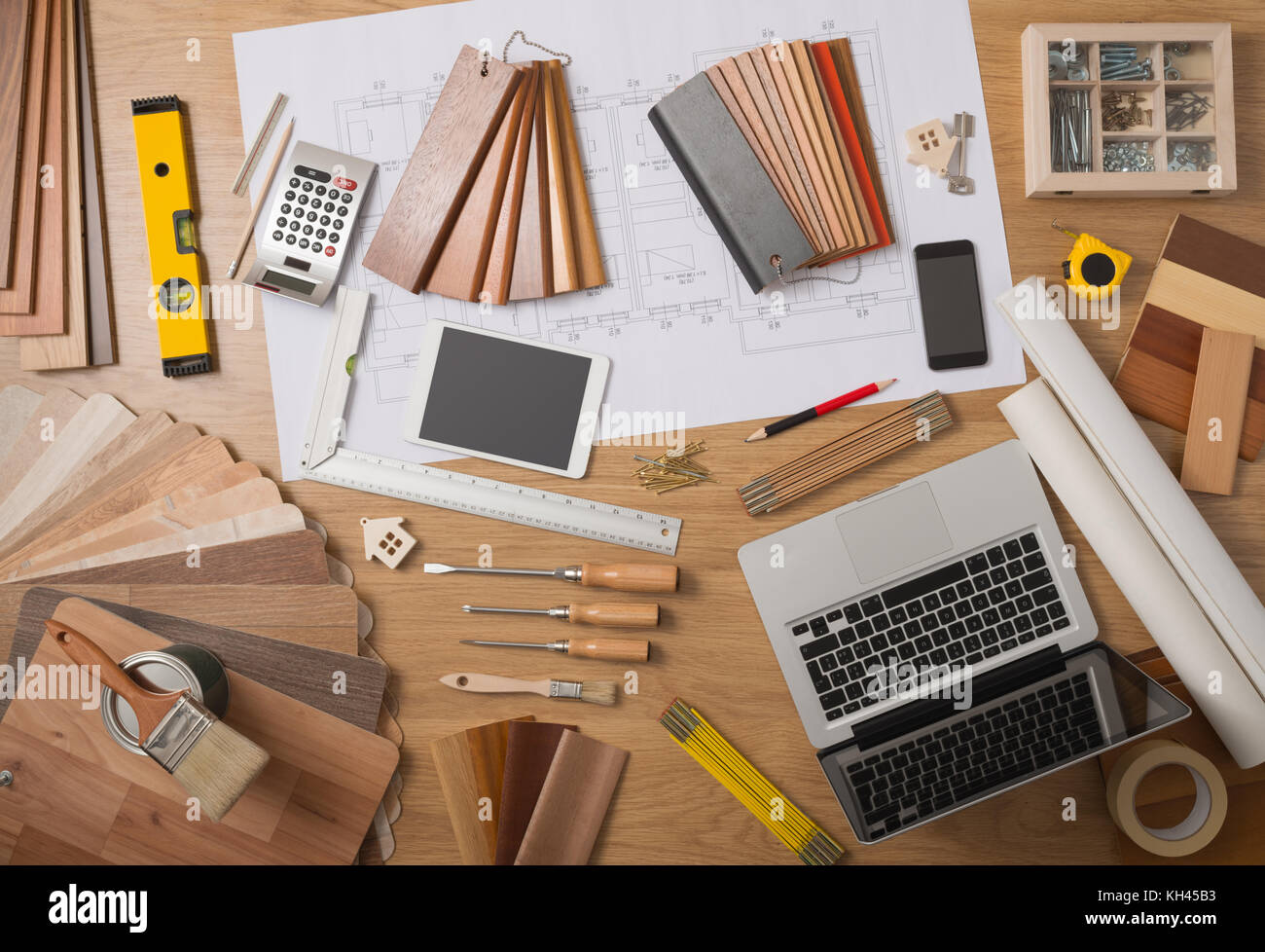 Architect and home interior decorator desktop with tools, laptop, wood ...