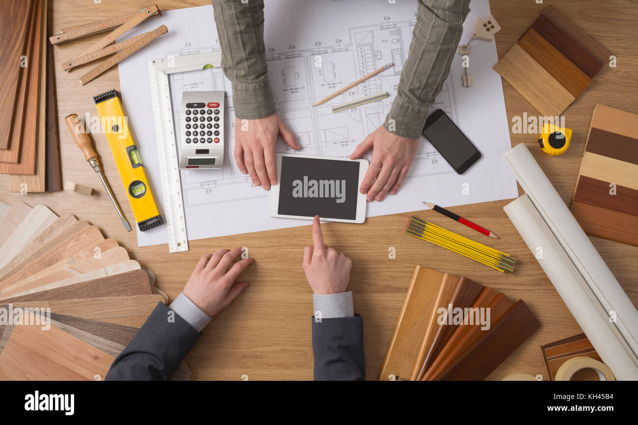 Customer businessman and construction engineer working together on a ...