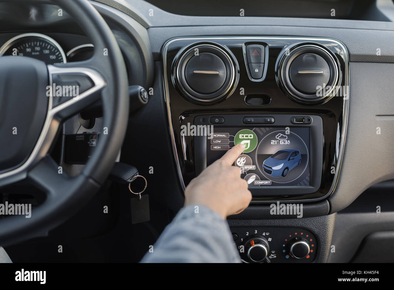 Woman using the car instrument panel and touching the digital touch ...