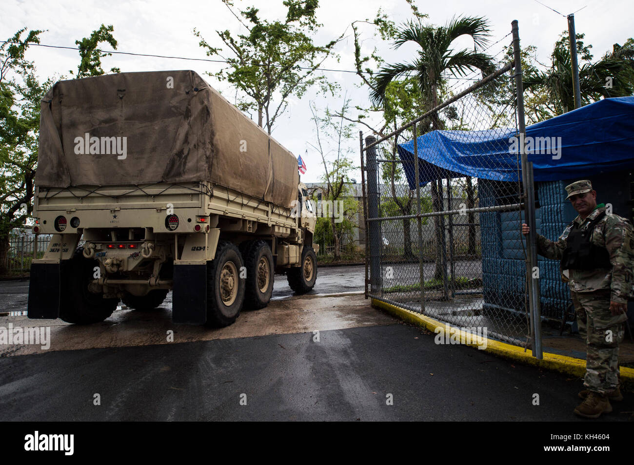 A U.S. Army transport vehicle carrying food and water provided by FEMA ...