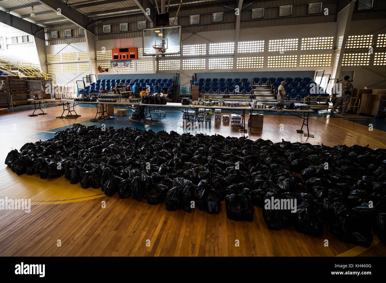 Food and water provided by FEMA is bagged and ready at a distribution ...