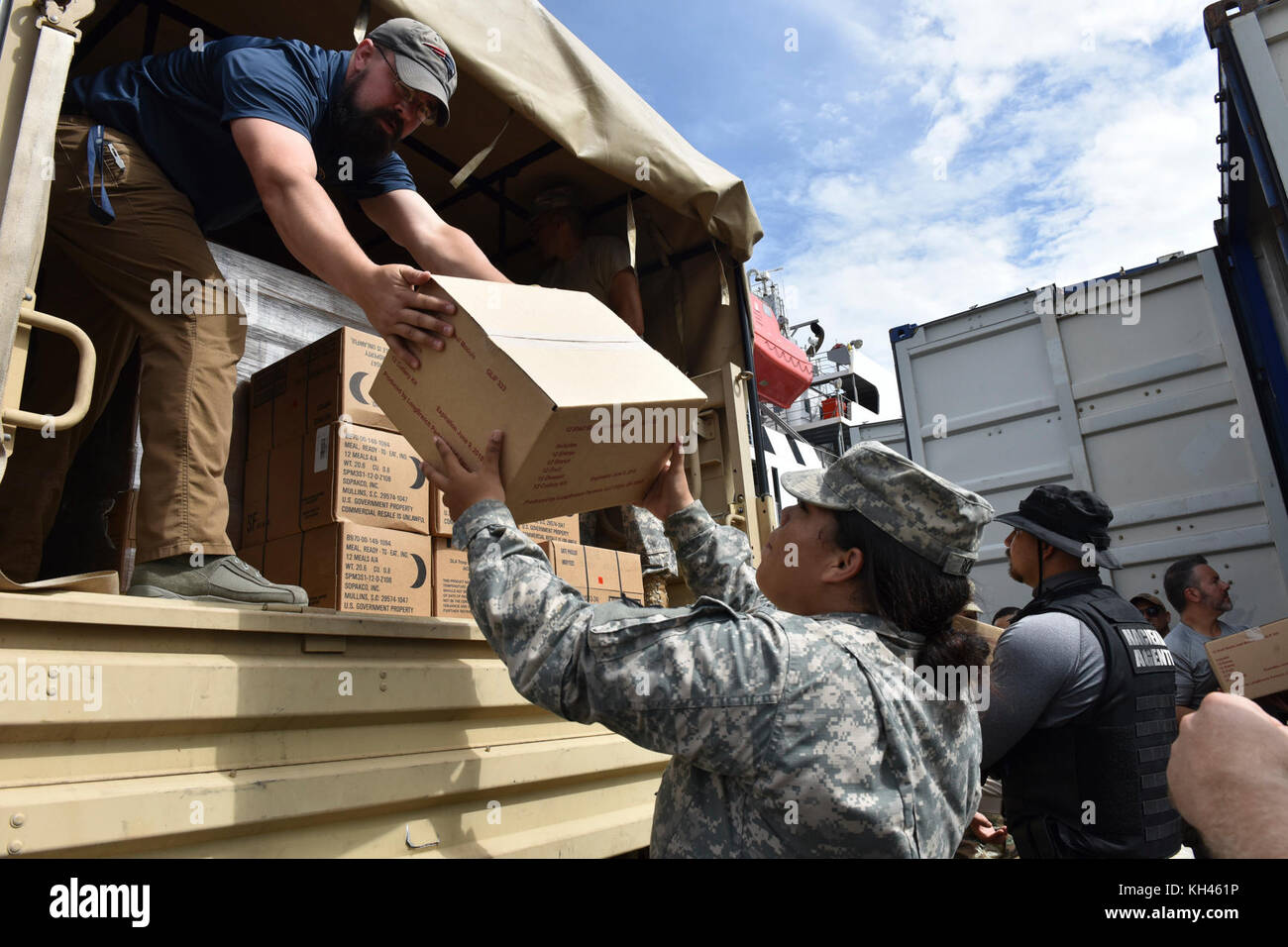 Members of the Coast Guard, FEMA, Army and Puerto Rico “Hacienda” load ...