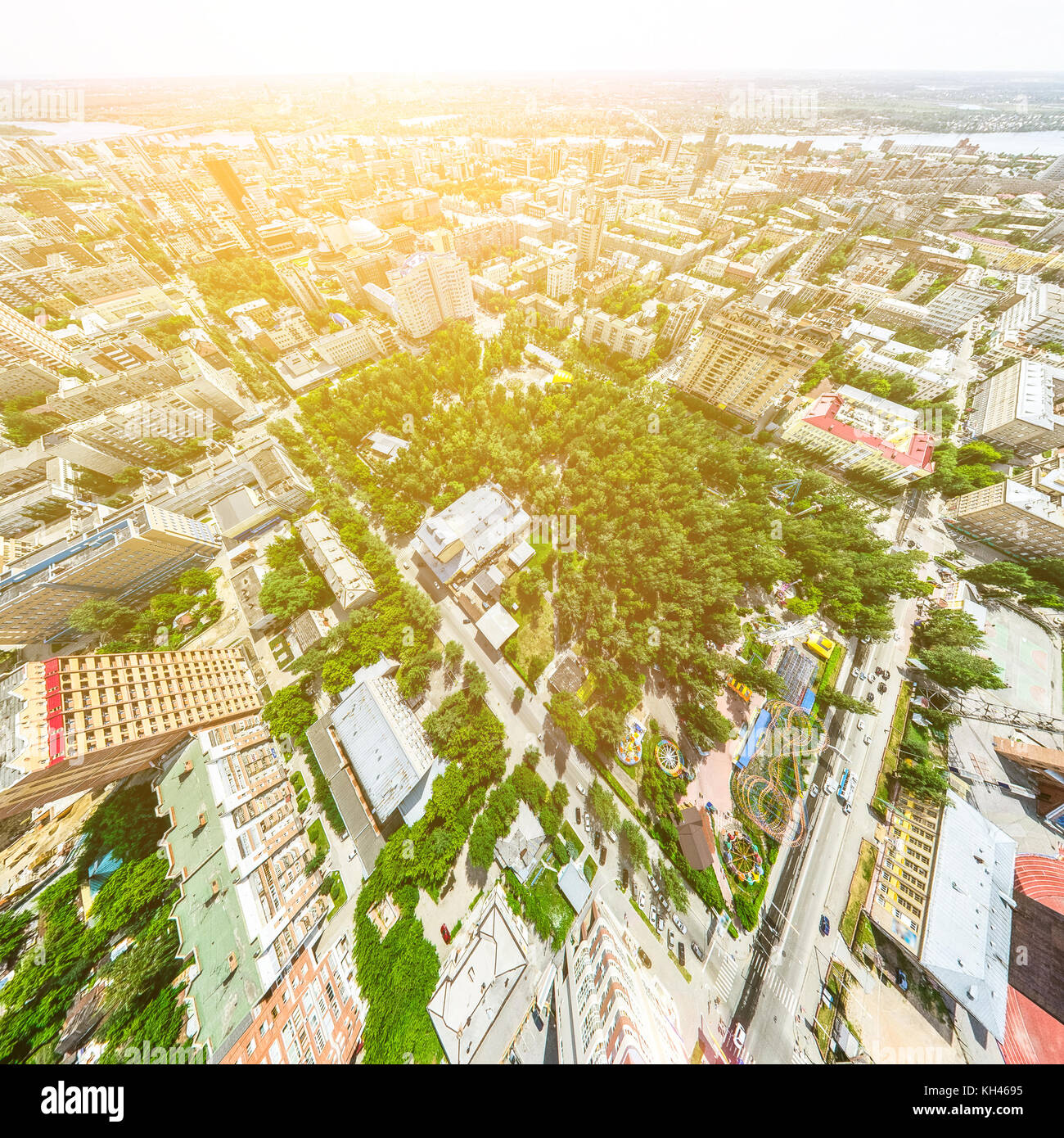 Aerial city view with crossroads and roads, houses, buildings, parks ...