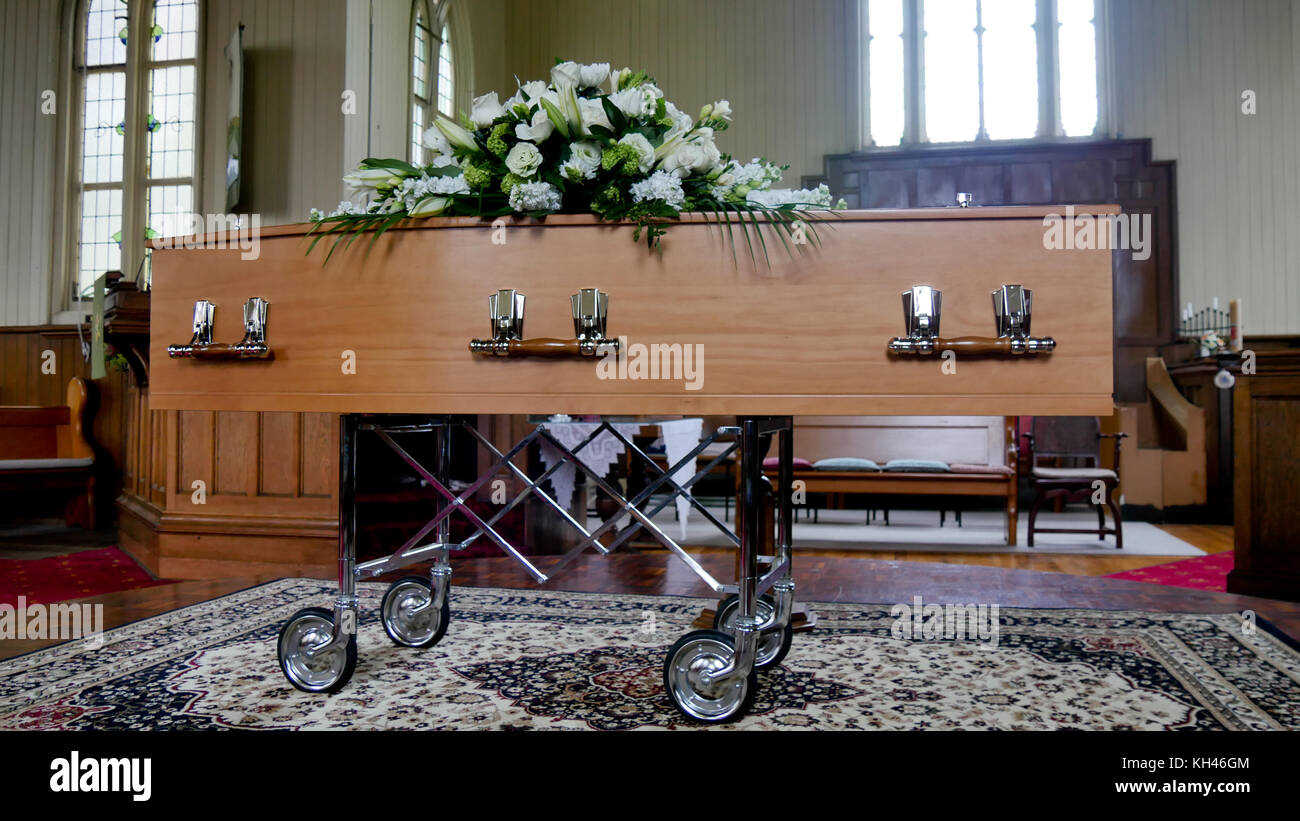 closeup shot of a colorful casket in a hearse or chapel before funeral ...