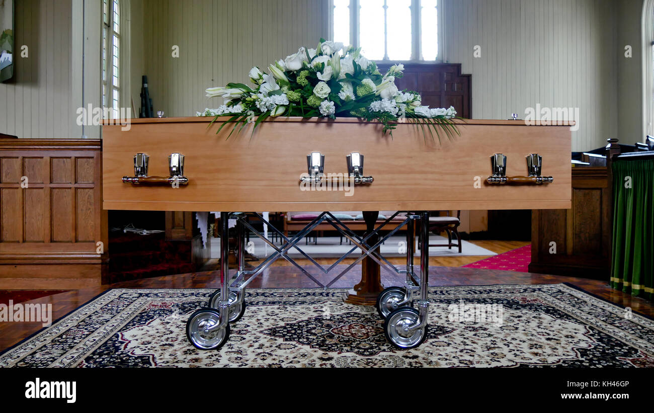 closeup shot of a colorful casket in a hearse or chapel before funeral ...