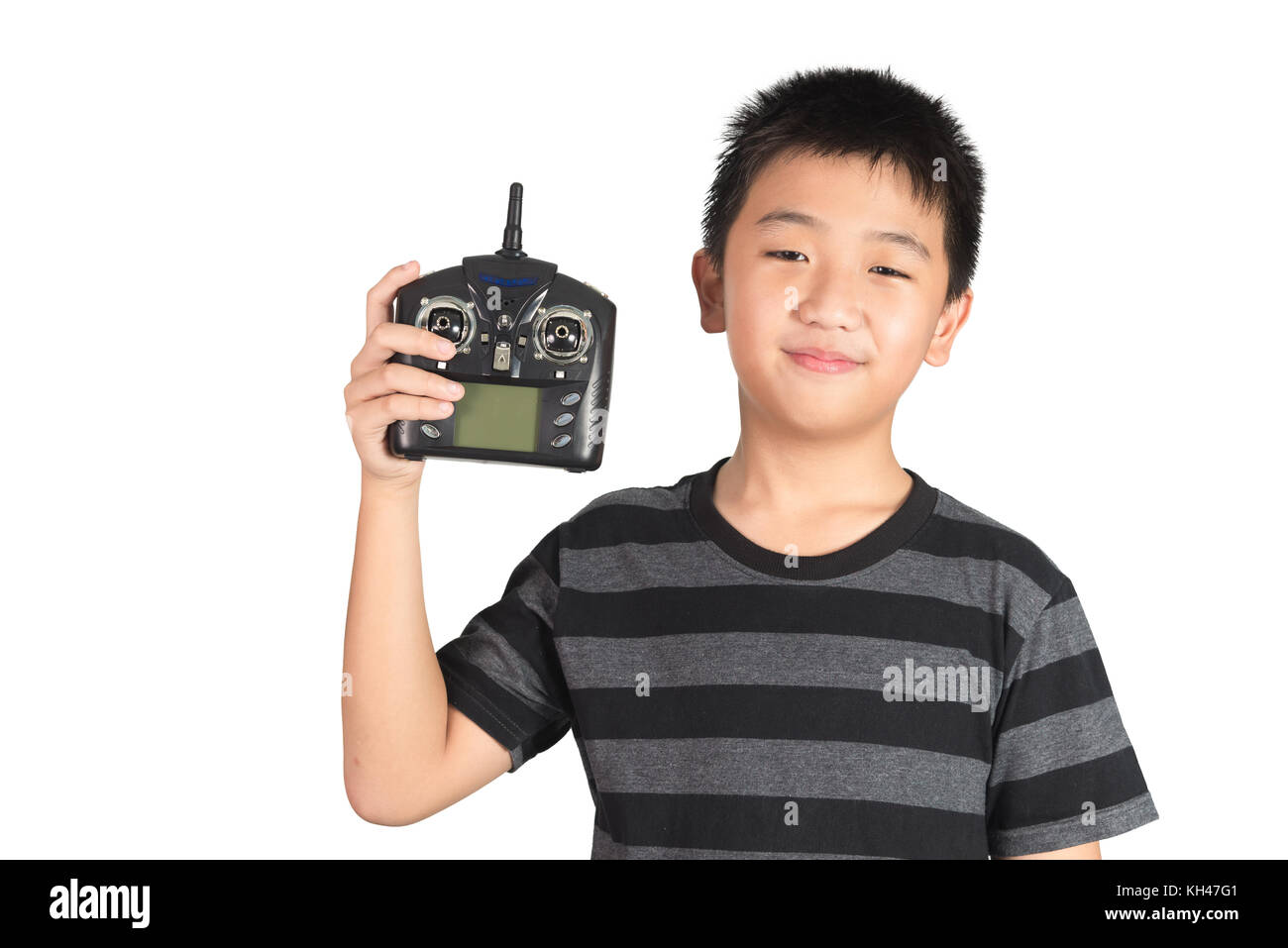 Asian boy holding radio remote control (controlling handset) for ...