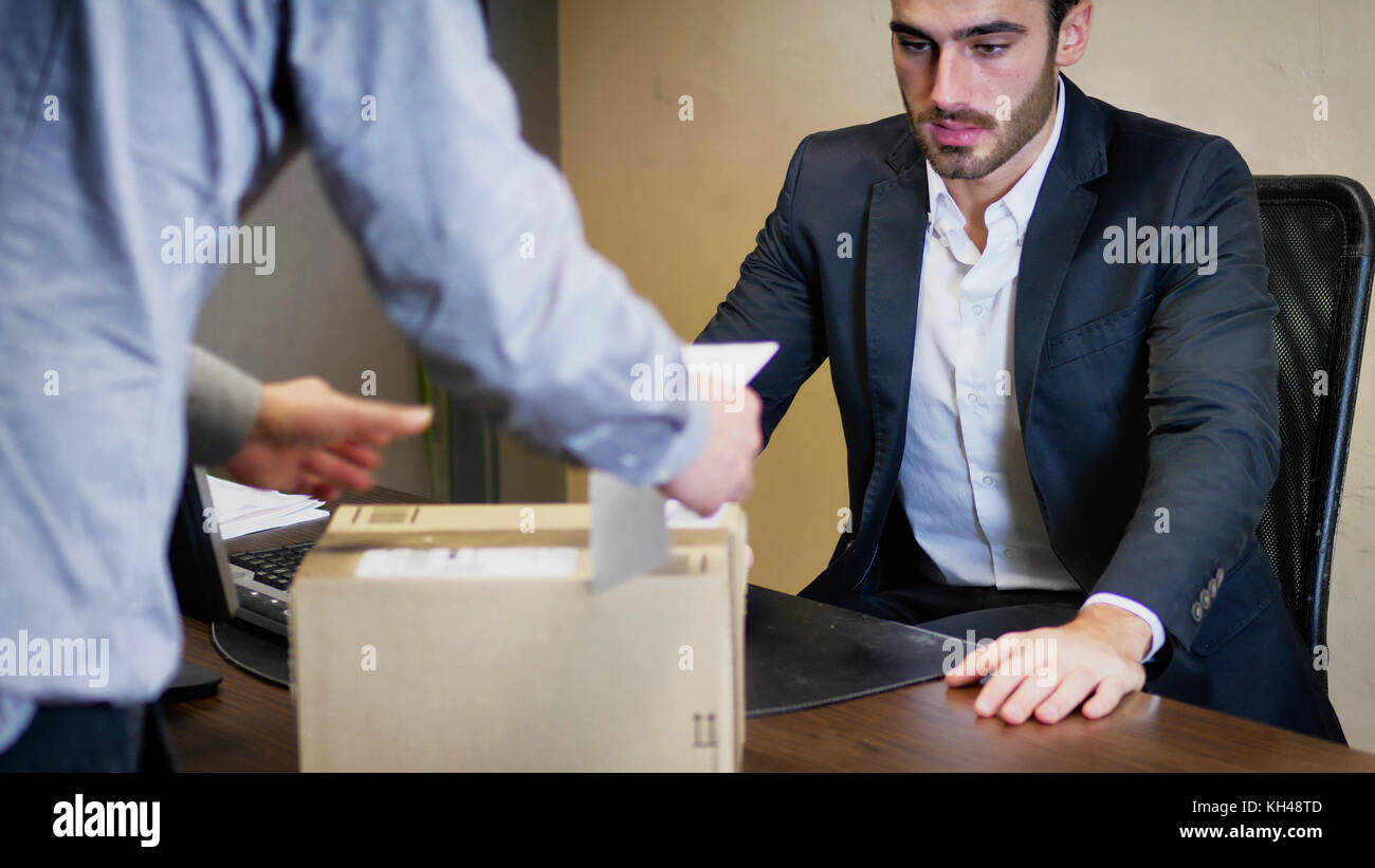 Businessman receiving parcel Stock Photo - Alamy