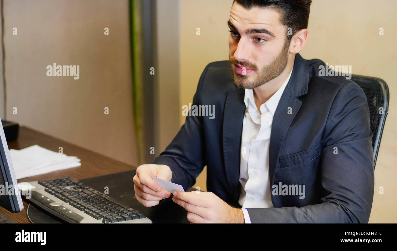 Businessman holding business card Stock Photo - Alamy Businessman holding business card Stock Photo - Alamy