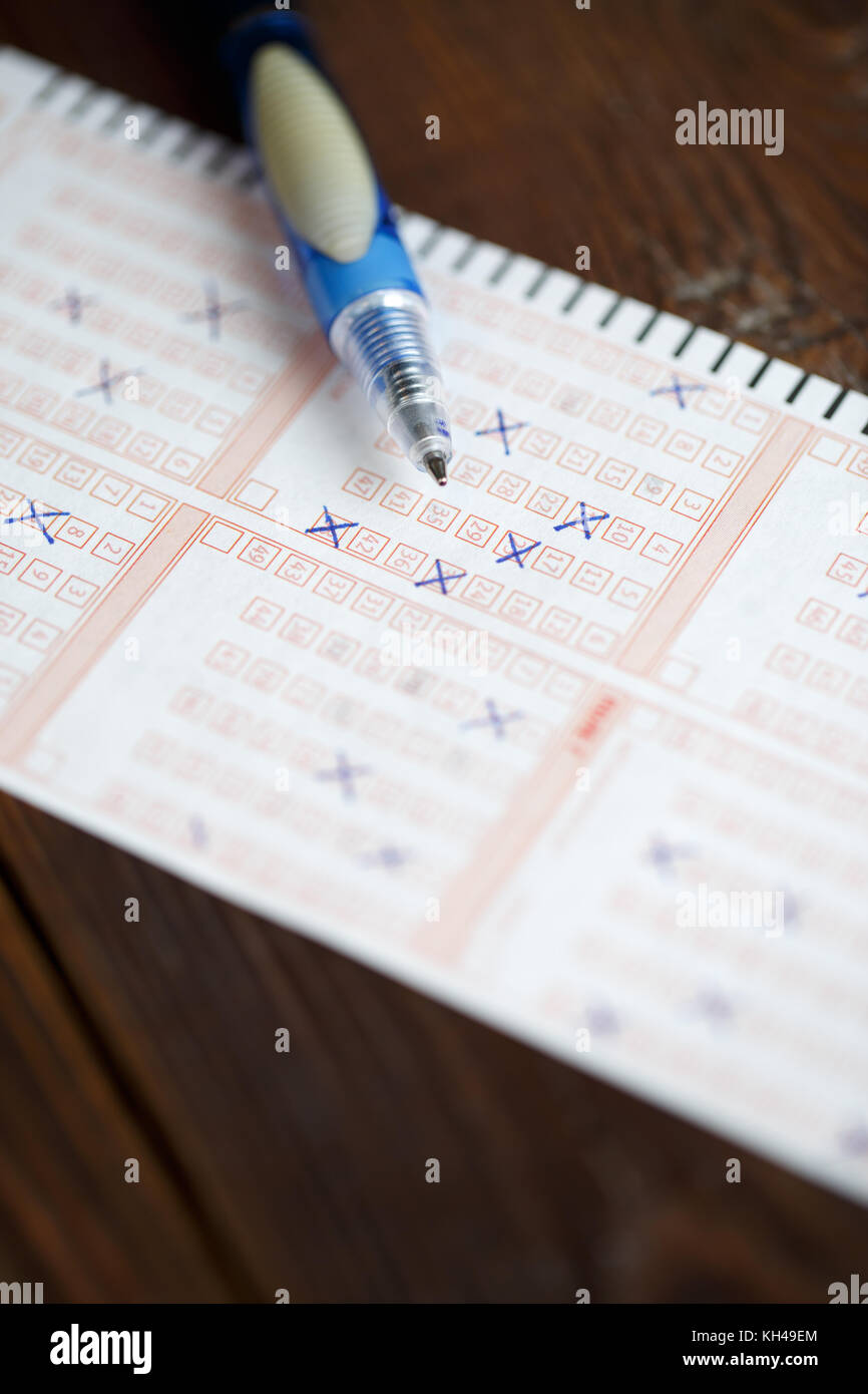 Photo on top of lottery ticket with marked numbers Stock Photo - Alamy
