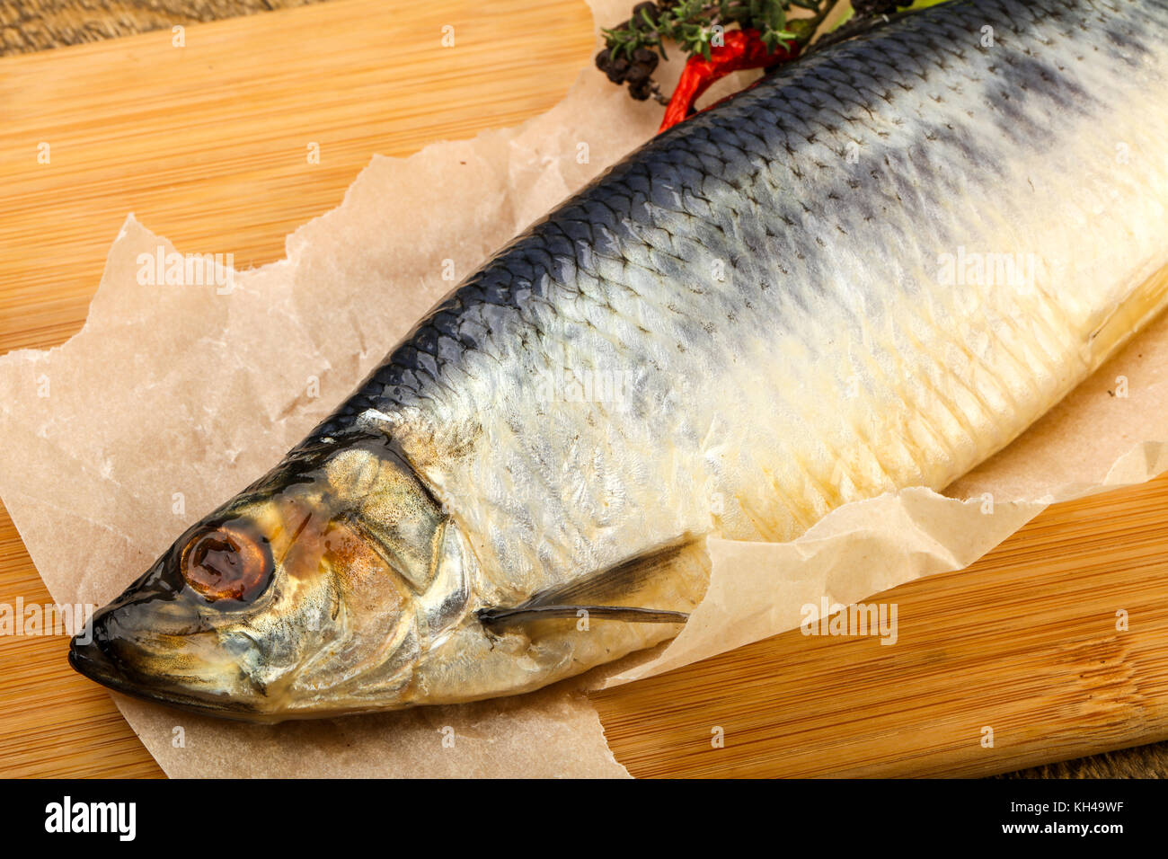 Salted Herring fish with pepper and spices Stock Photo - Alamy
