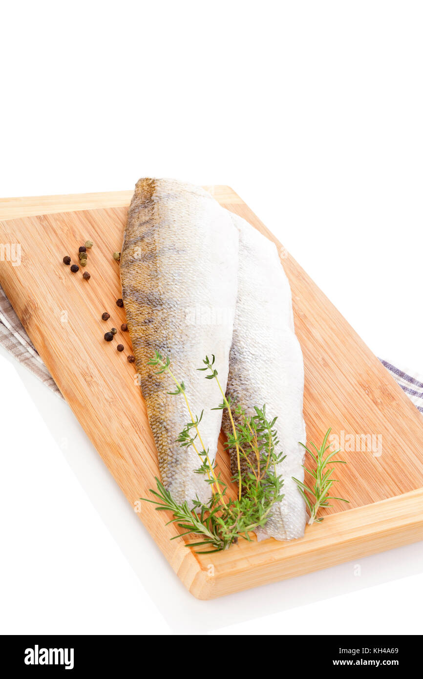 Fillet fish slices on wooden chopping board isolated on white ...