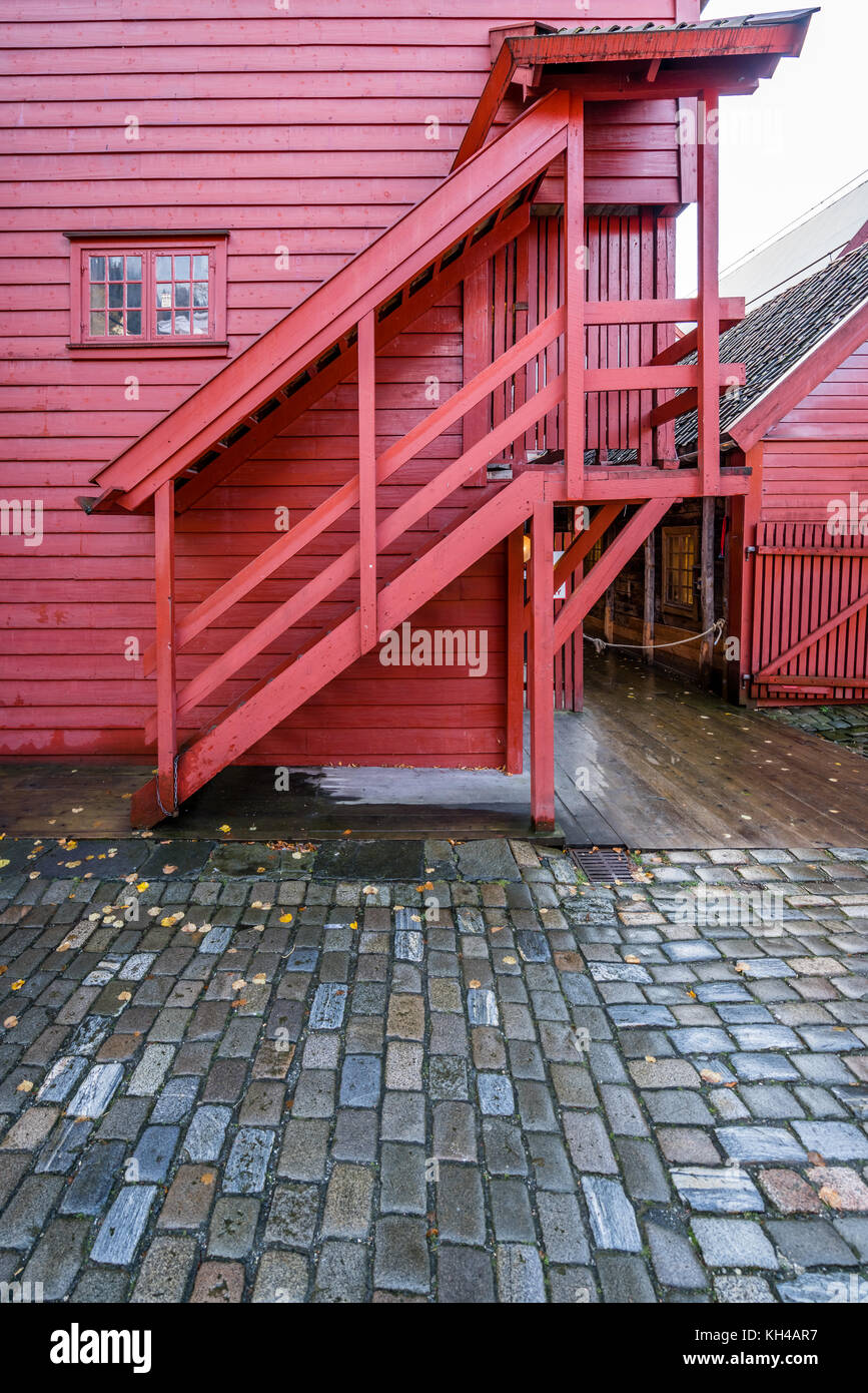 Historic red wooden building in Bryggen, the old town of Bergen, a ...