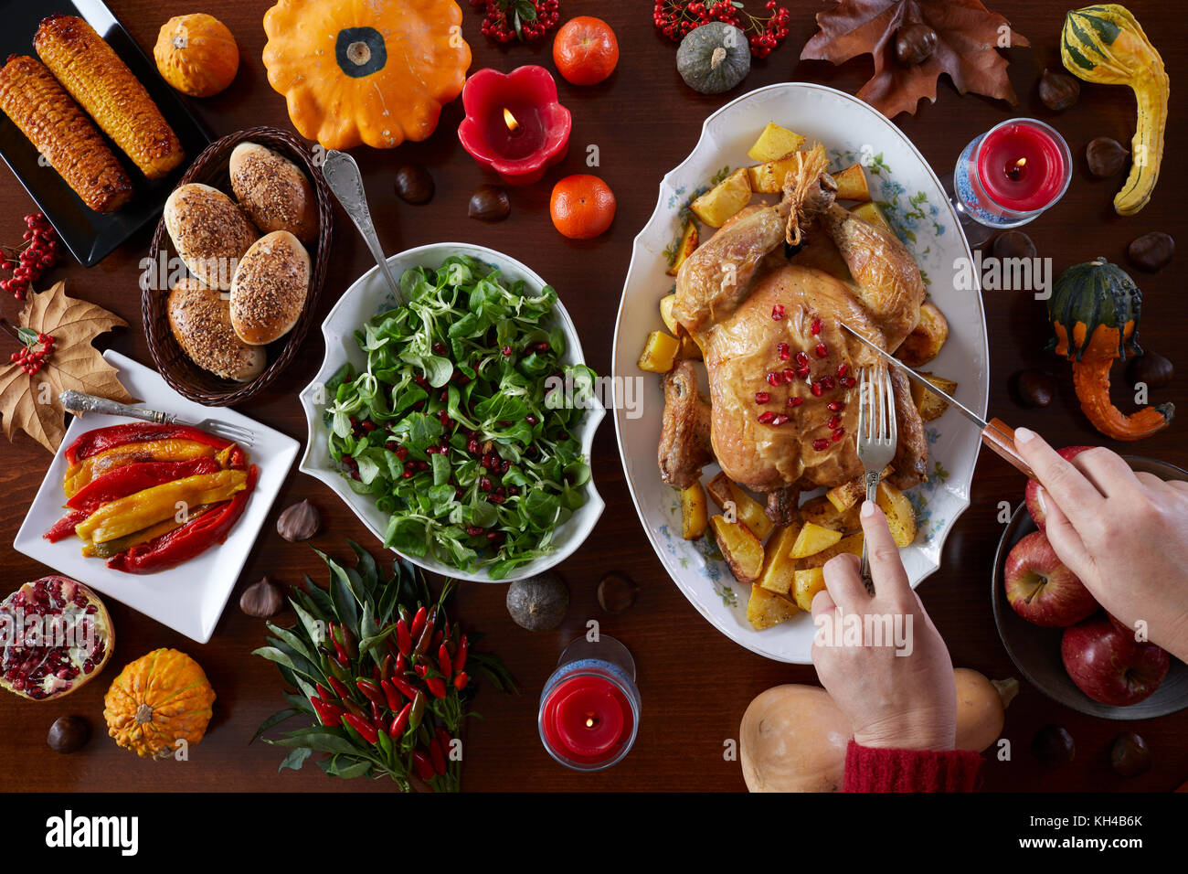 Thanksgiving traditional food on the table decorated with gourds ...