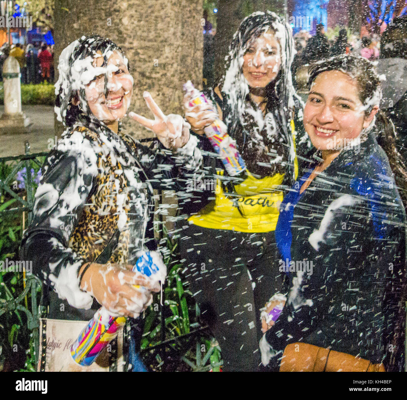 Foam is sprayed on everyone in annual party in Cuenca, Ecuador on Feb 4 ...