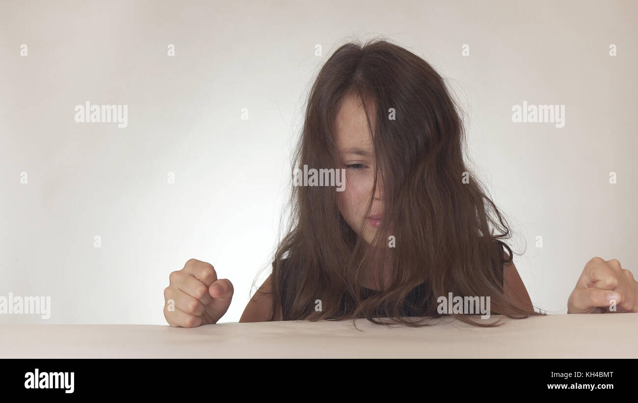 Beautiful sad teenage girl expresses resentment and sadness on white ...
