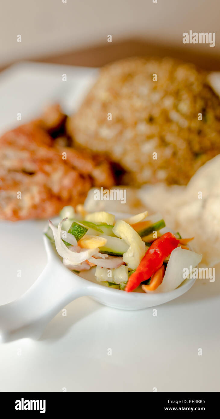 colorful pickles served with fried rice Stock Photo - Alamy