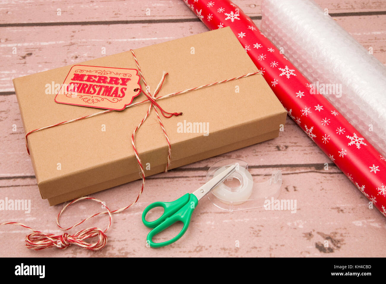 Wrapping Holiday Gifts in a Kraft Box Stock Photo - Alamy
