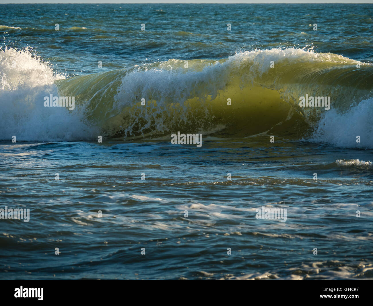 The waves of the Atlantic are lighted by the sunset. Gale on the ...