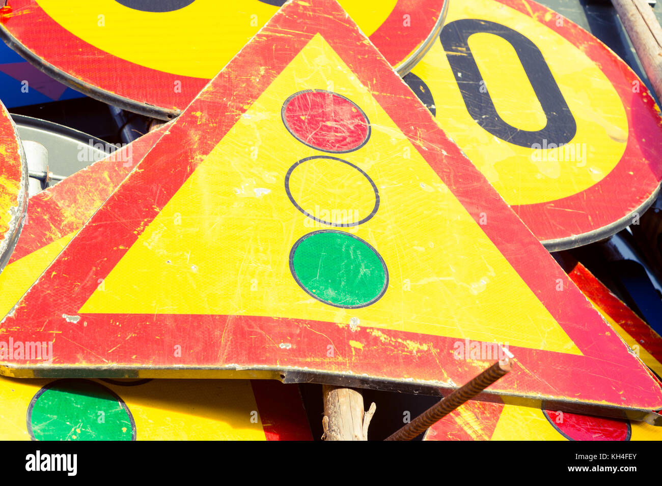 Used yellow industrial road signs with traffic lights or semaphore ...