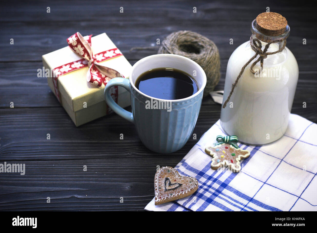 Festive still life with a bottle, a cup , biscuits, a box Stock Photo ...