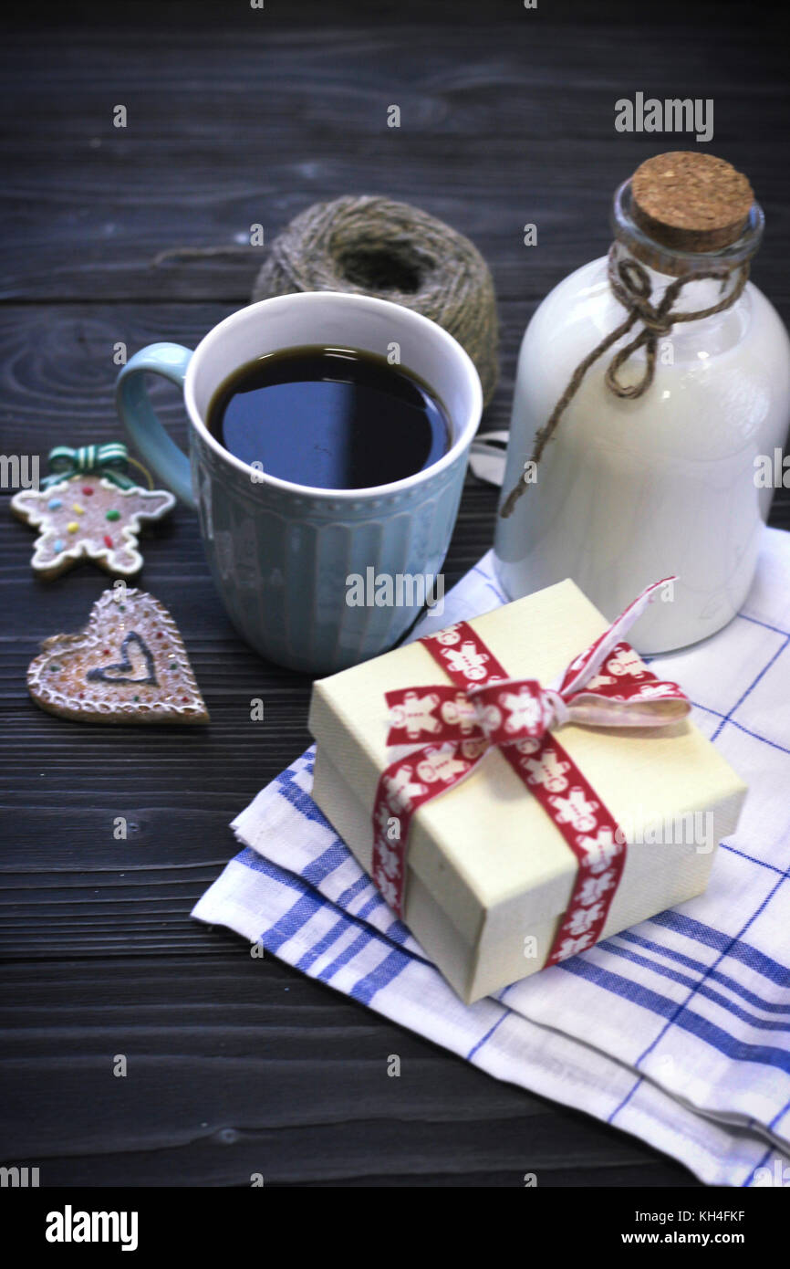 Festive still life with a bottle, a cup , biscuits, a box Stock Photo ...