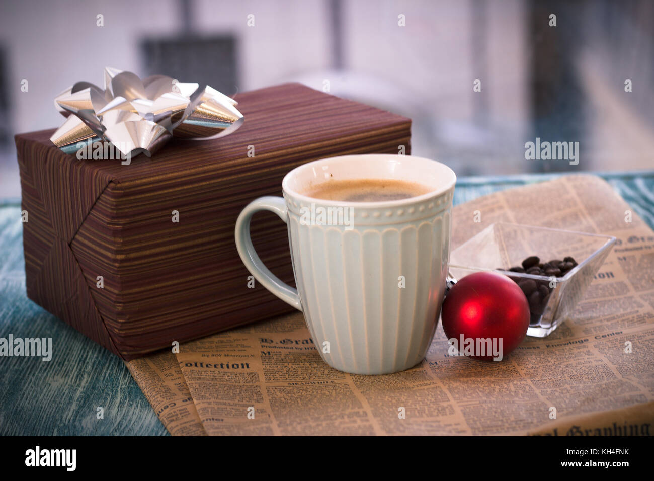 Festive still life with box, cup, vase, ball, newspaper Stock Photo - Alamy