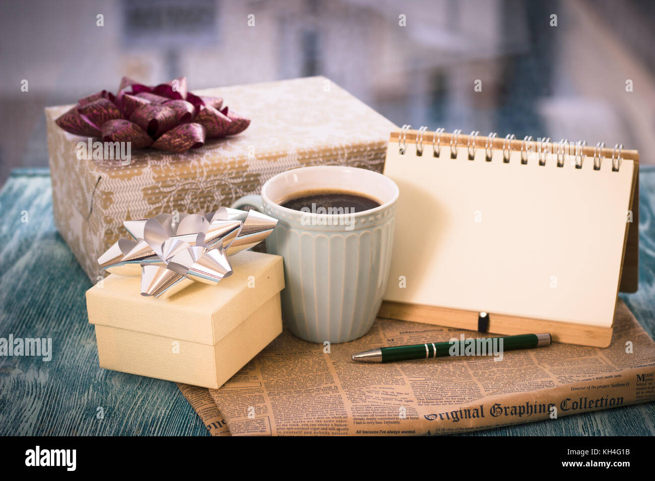 A festive still-life with presents, a cup, a notebook Stock Photo - Alamy