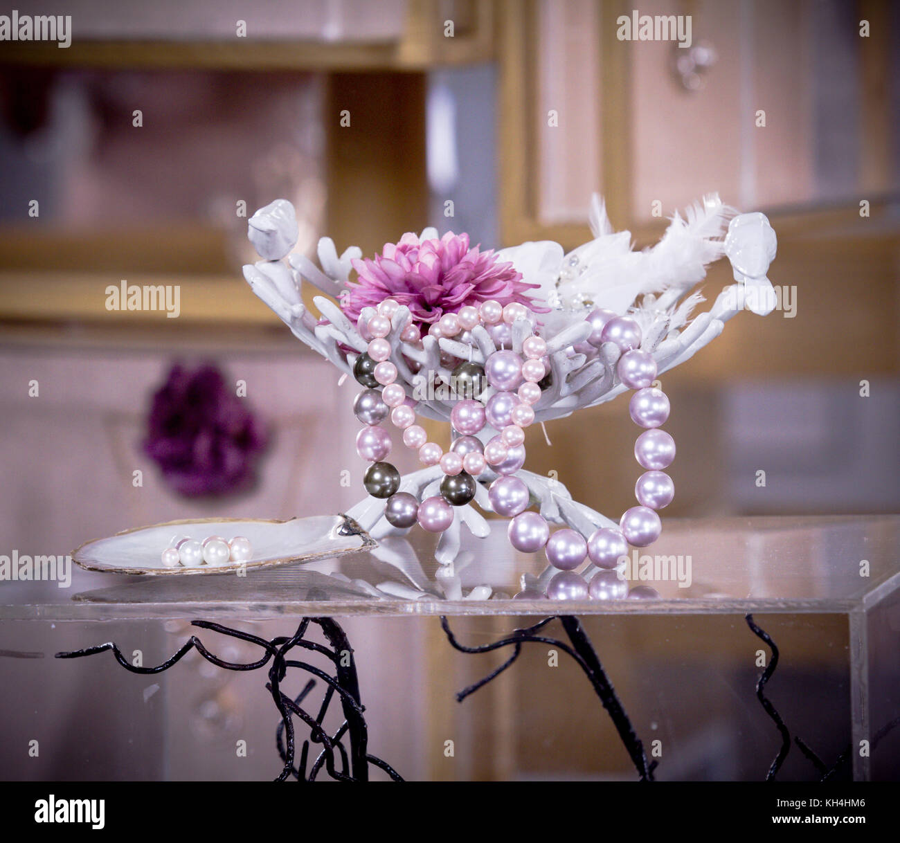 pearl necklace display in container coral shape Stock Photo - Alamy