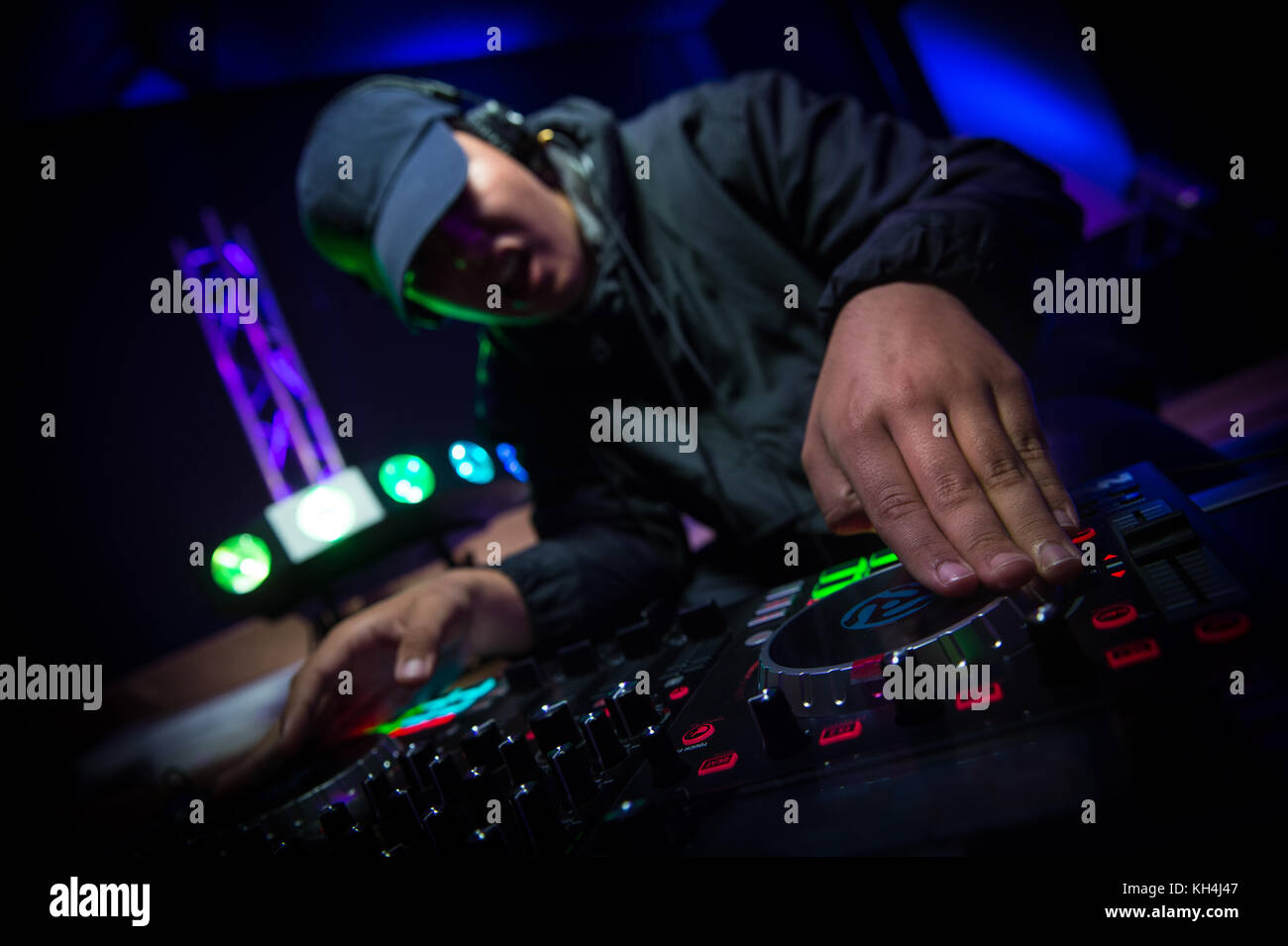 Disc jockey at the turntable dj plays on the best famous cd players at ...