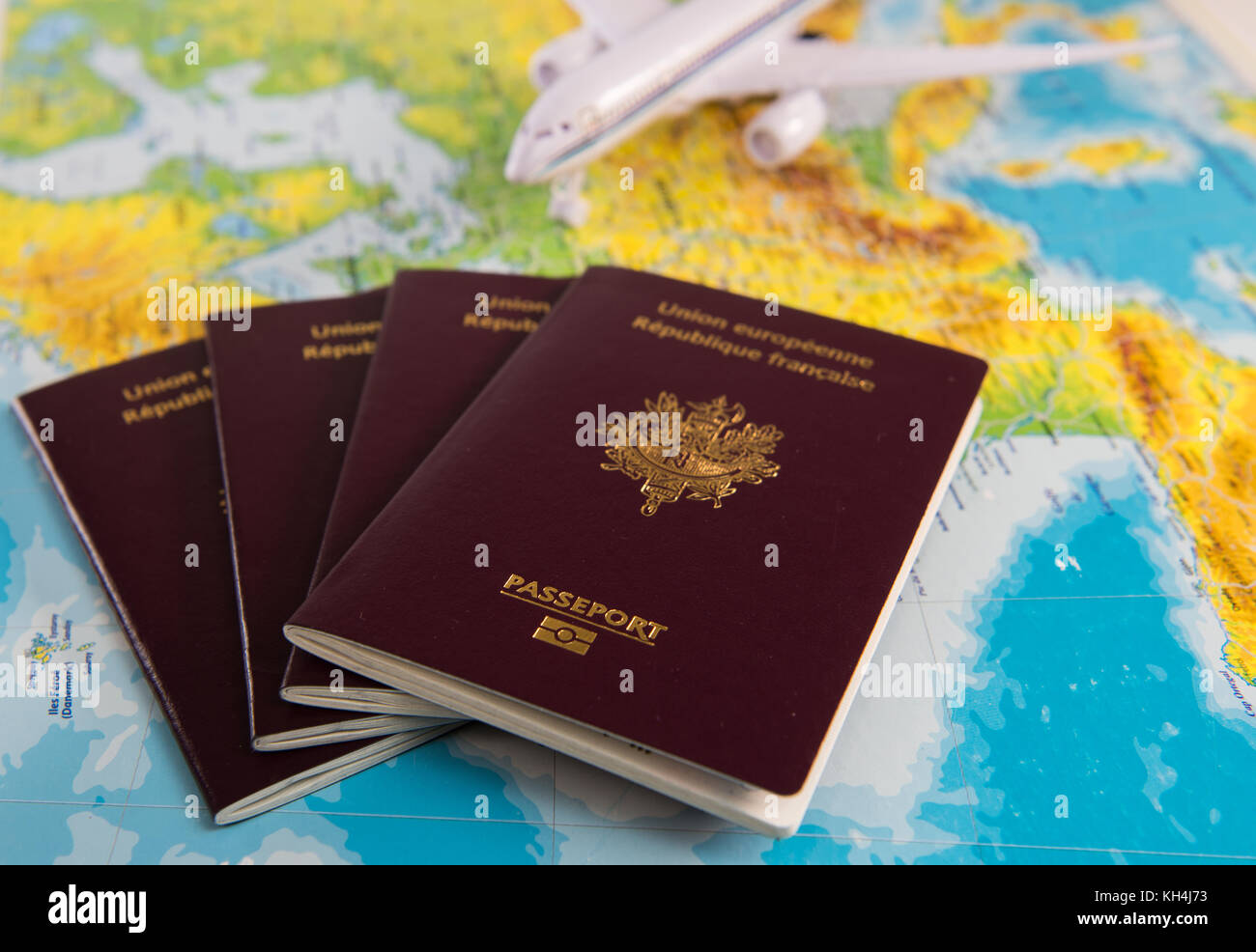 French passports on map and plane background, France Stock Photo - Alamy