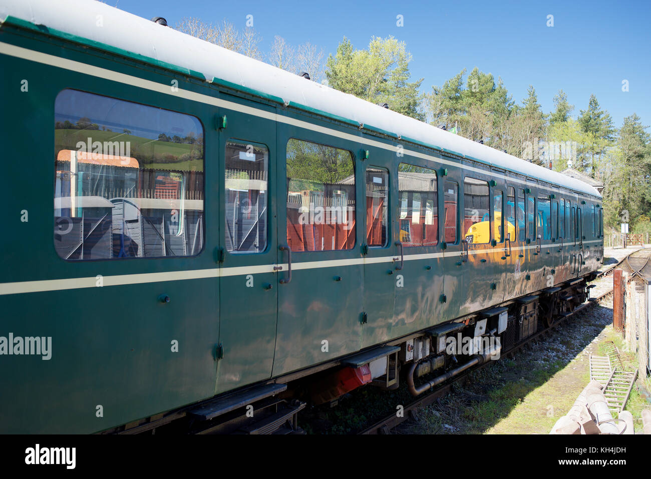 Reflection in the windows of a diesel unit on the South Devon Railway ...