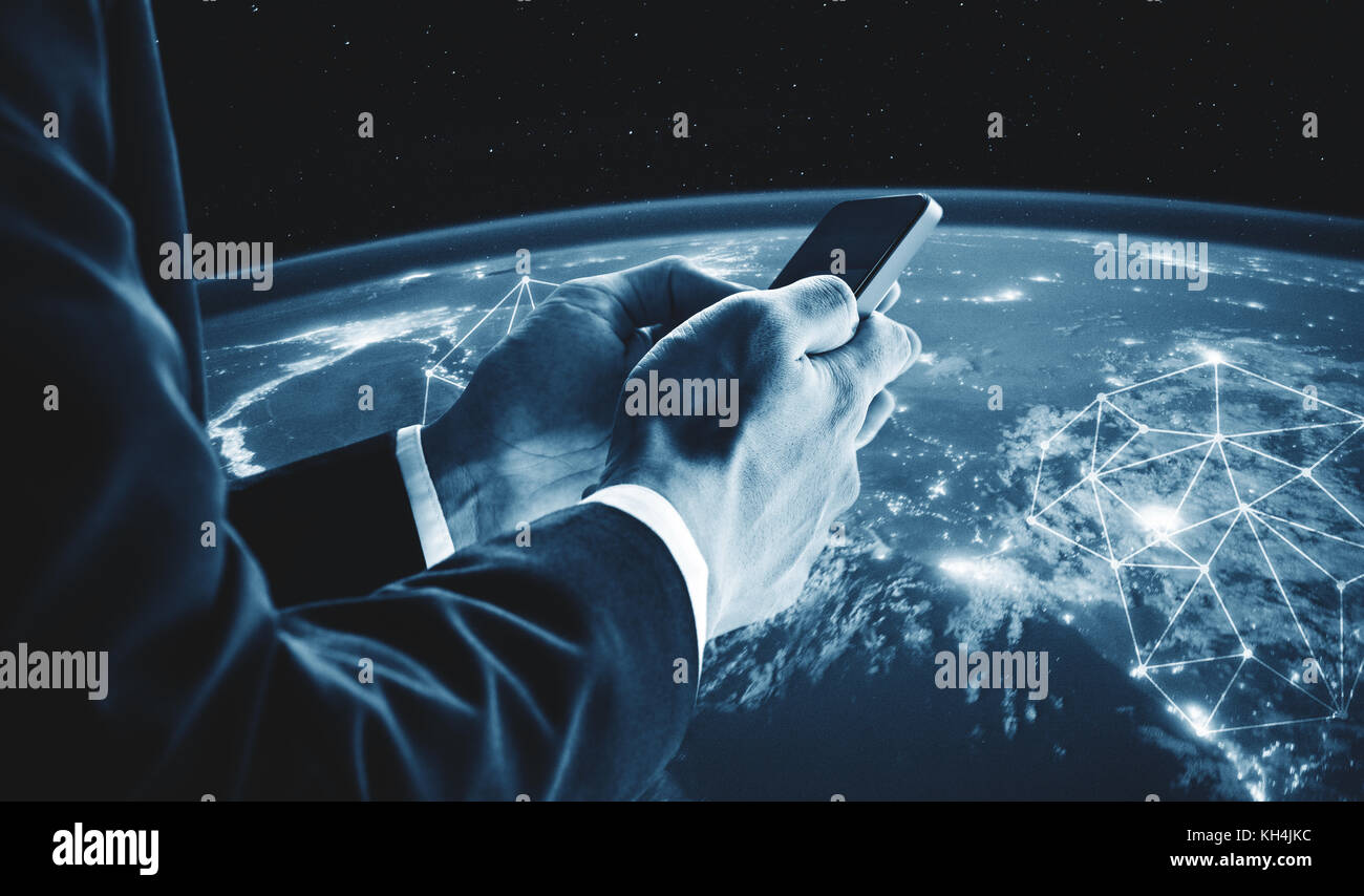 Businessman using mobile smart phone with global network connection ...